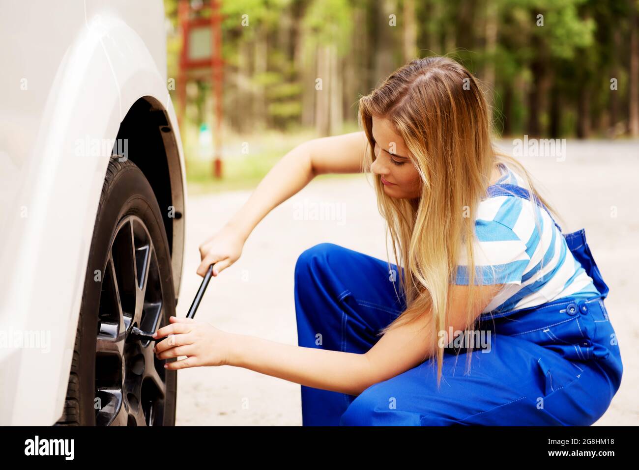 Woman fixing car engine hi-res stock photography and images - Alamy