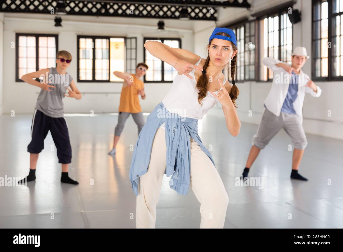 Team of young dancers training moves Stock Photo - Alamy