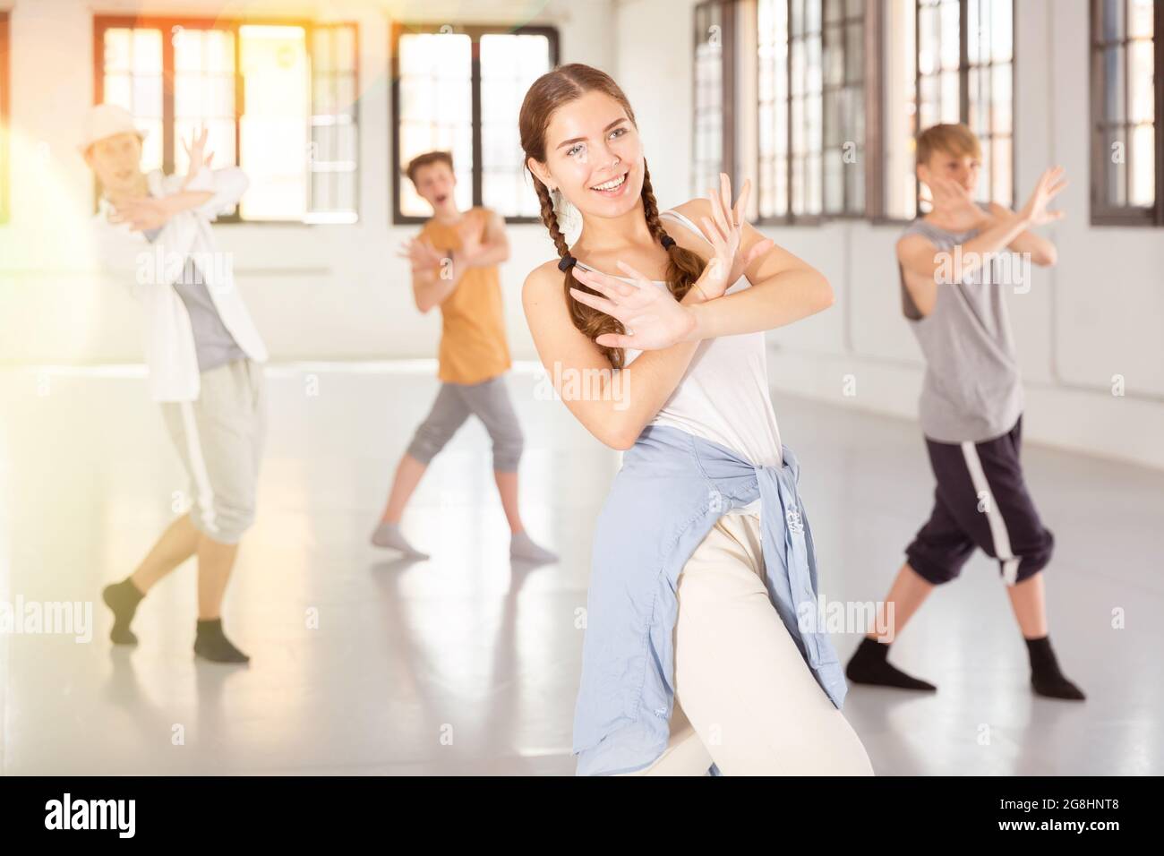 Teenage girl practicing active dance at studio Stock Photo - Alamy