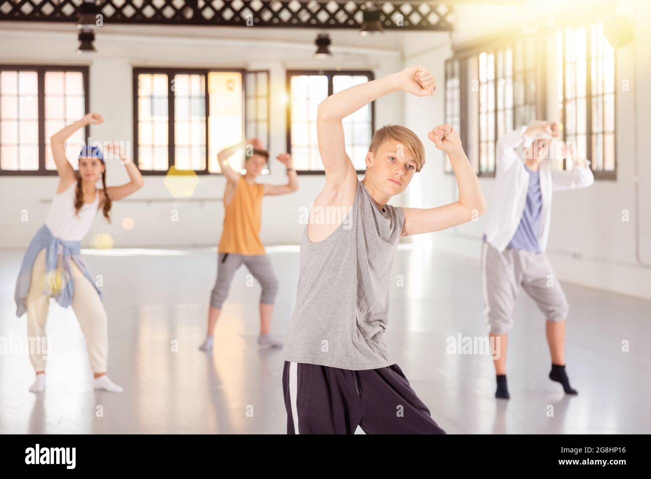 Team of young dancers training moves Stock Photo - Alamy