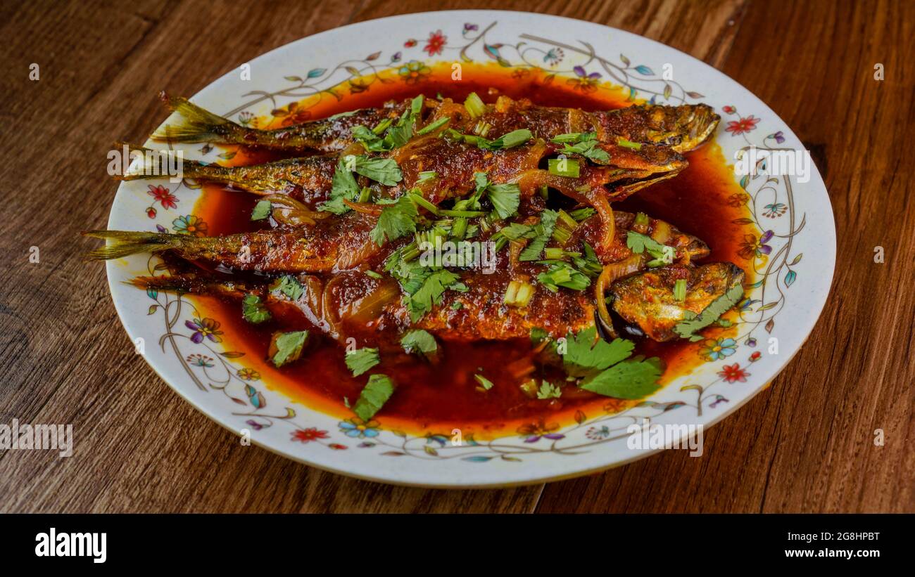 Fried Mackerel (ikan sardin) cooked with spicy sambal red chilli and ...