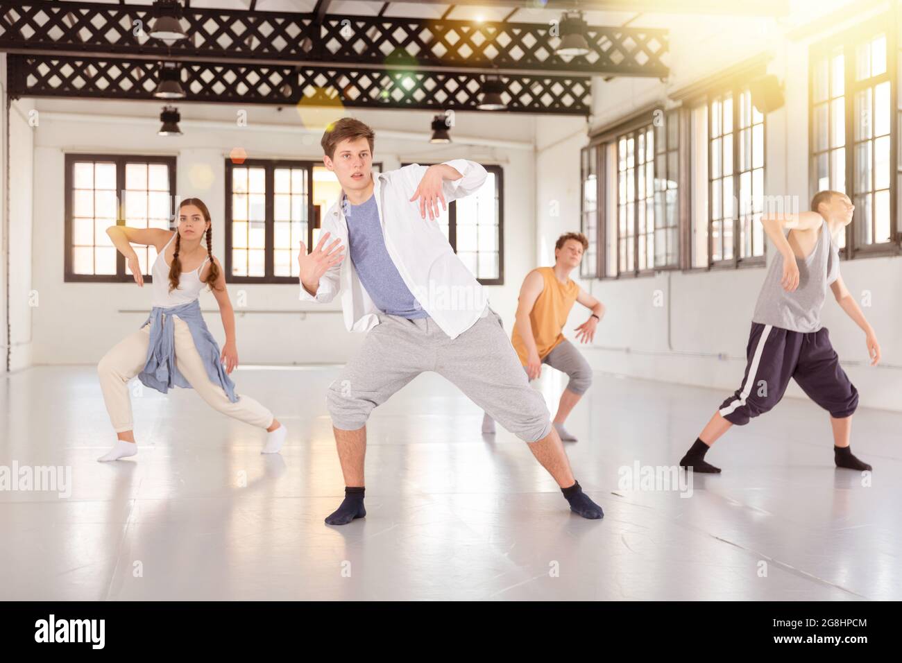 Group teenagers dancing hip-hop indoors Stock Photo - Alamy