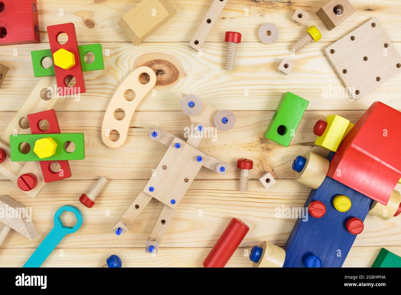 A colorful wooden building kit, a robot for children on wood. Set of ...