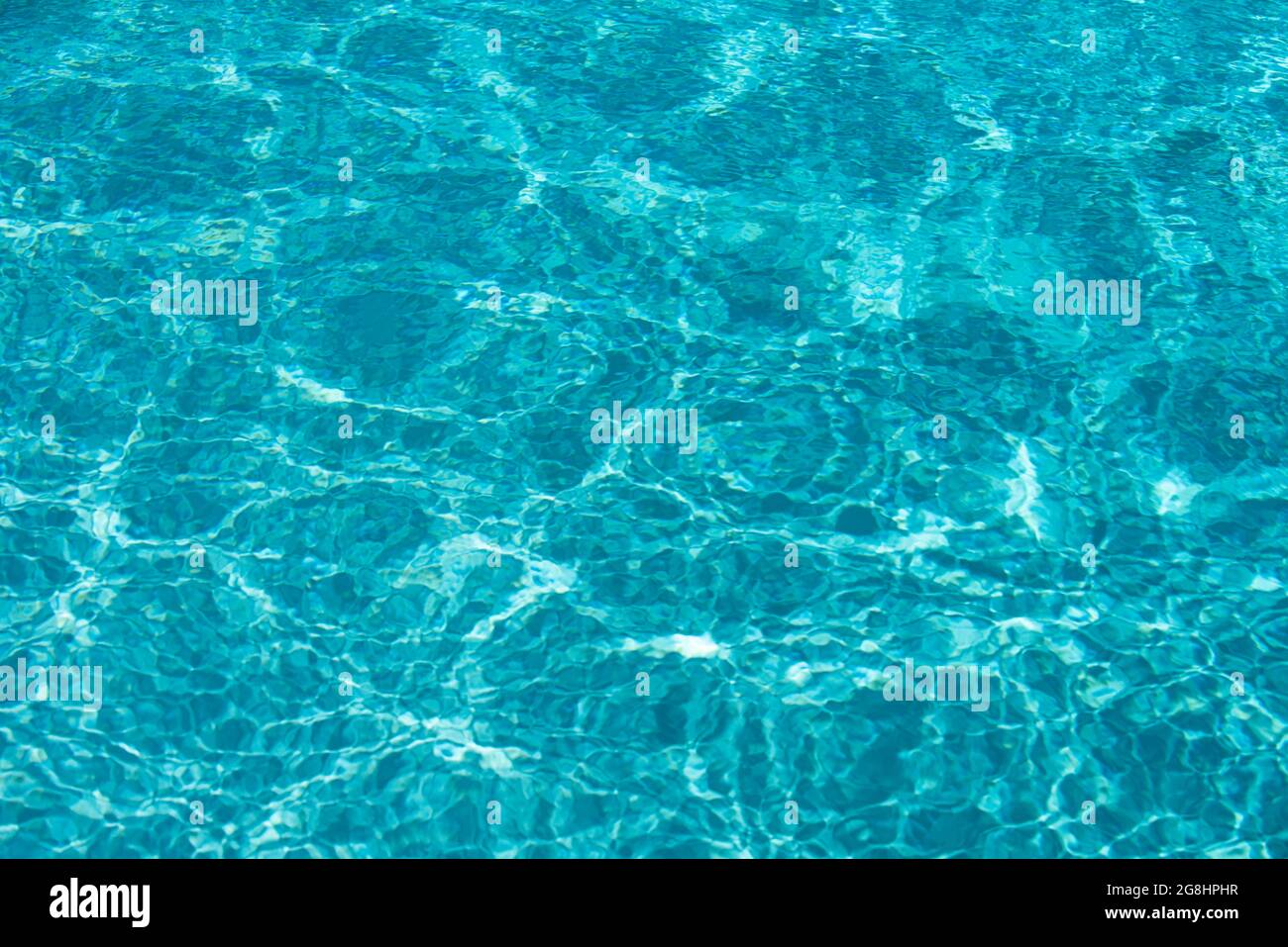 Abstract ripple wave and clear turquoise water surface in swimming pool ...