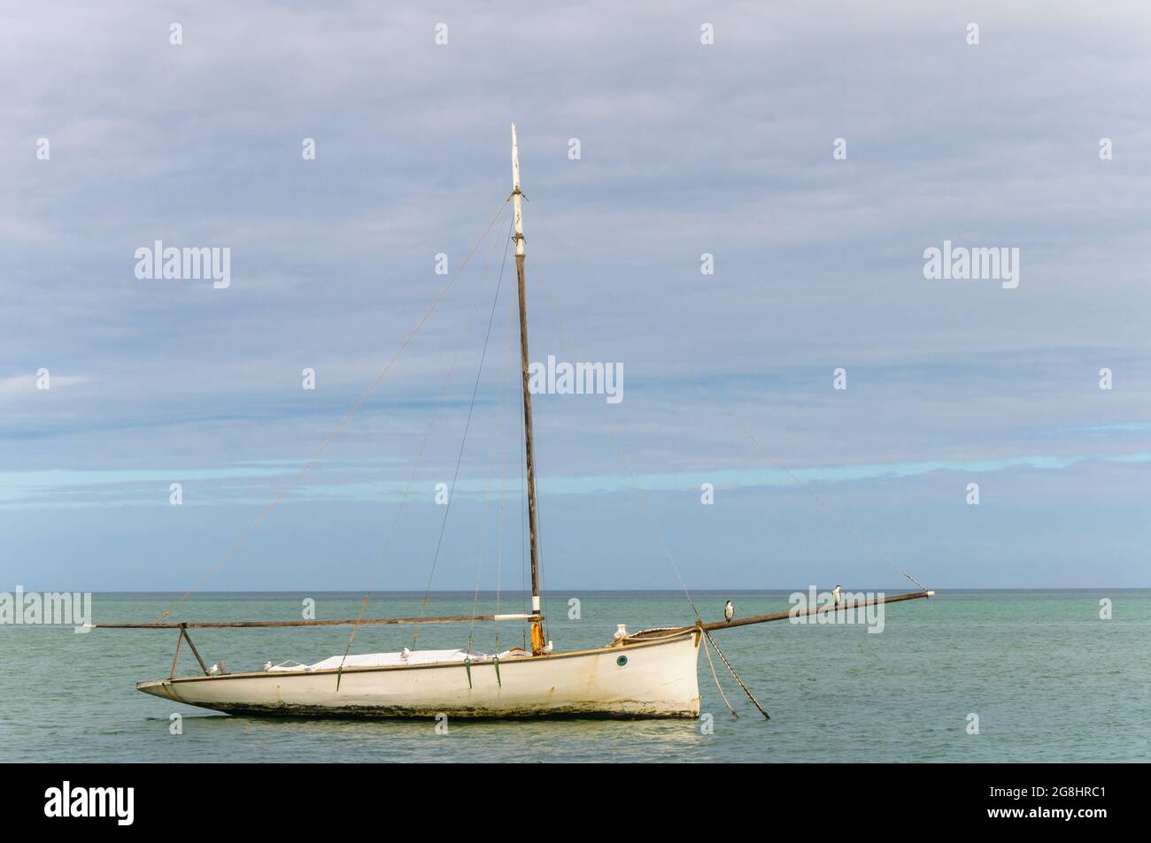 The historic, pearl lugger Galli-Curci or 'The Galla' anchored on calm ...