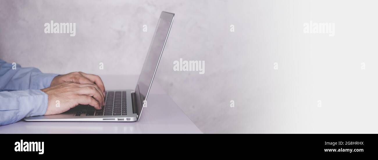 Hands of man typing laptop computer with webinar on desk, video ...