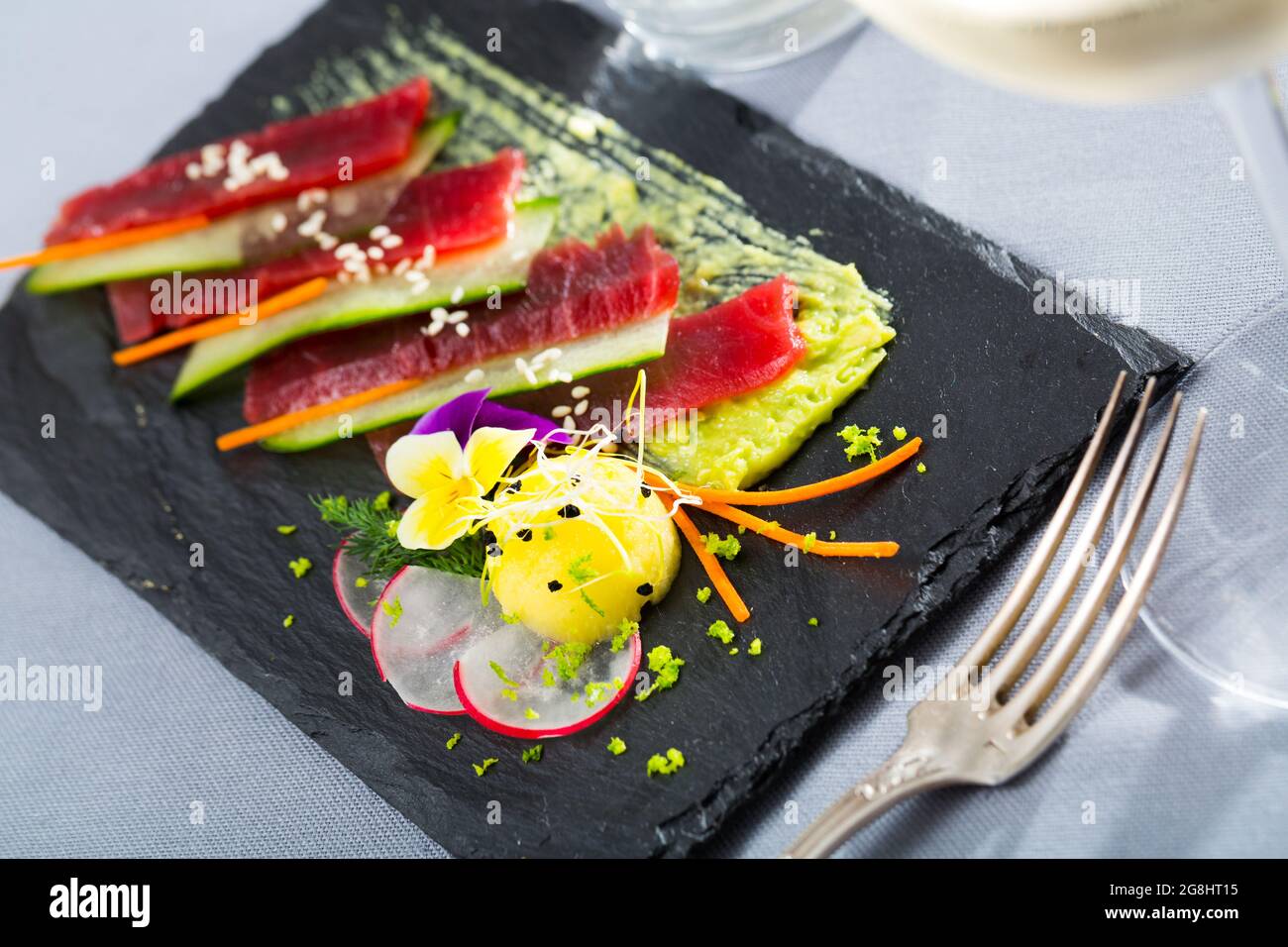 Tuna sashimi with cucumber and avocado sauce Stock Photo - Alamy