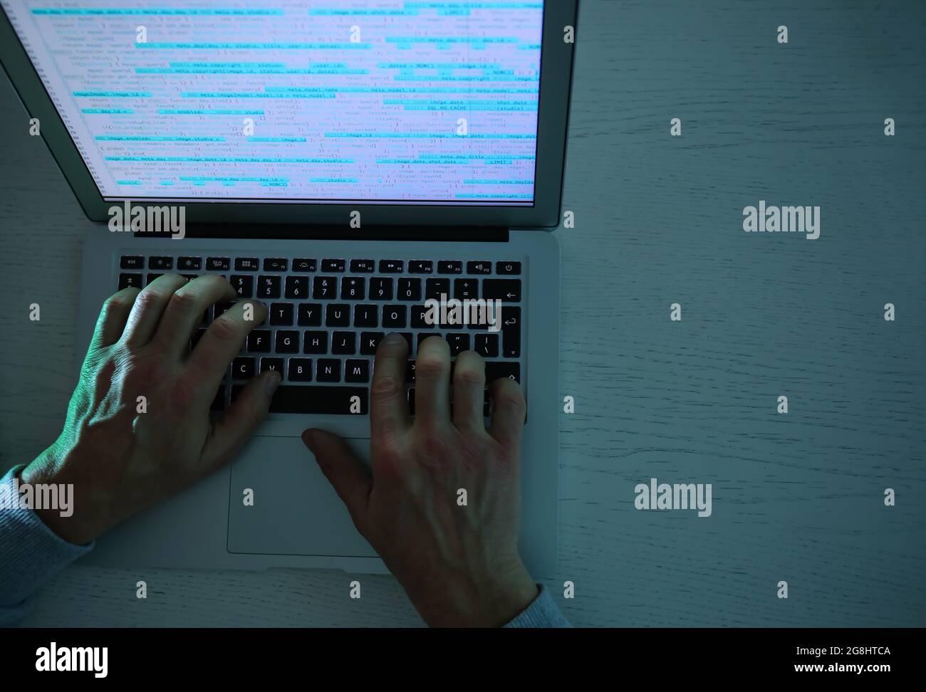Hacker using computer, top view Stock Photo - Alamy