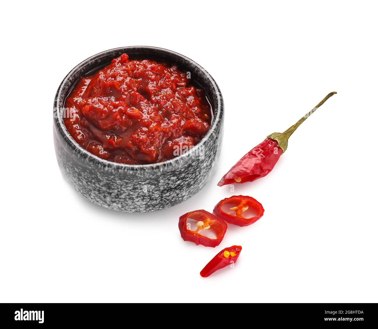 Bowl of chili sauce on white background Stock Photo - Alamy