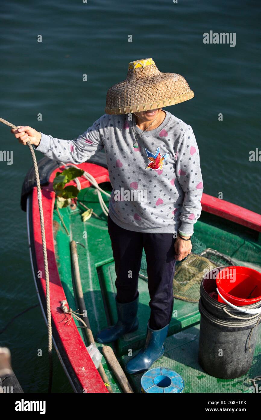 fishing woman at work in cheung chau Stock Photo - Alamy