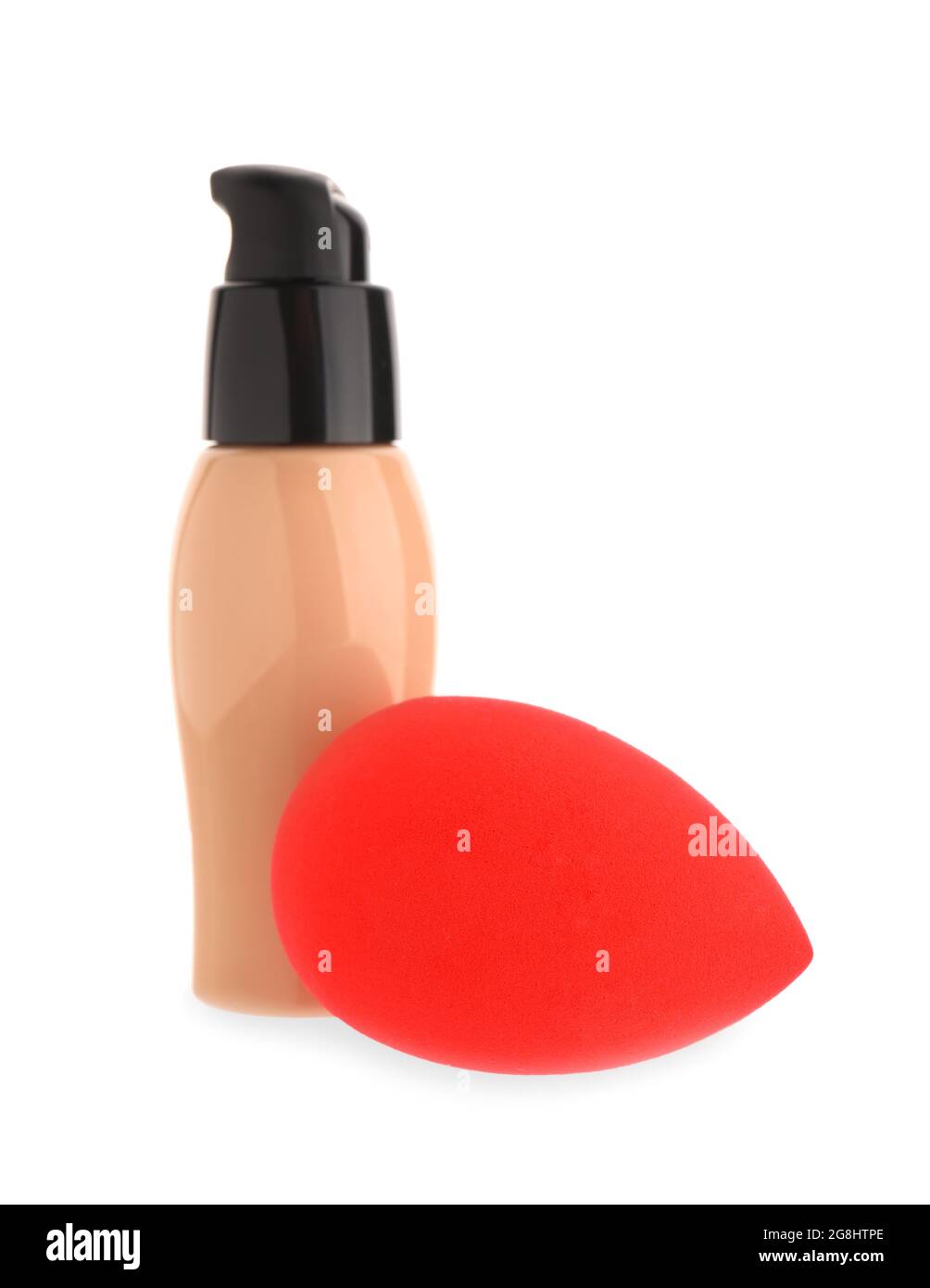 Tonal foundation with makeup sponge on white background Stock Photo - Alamy