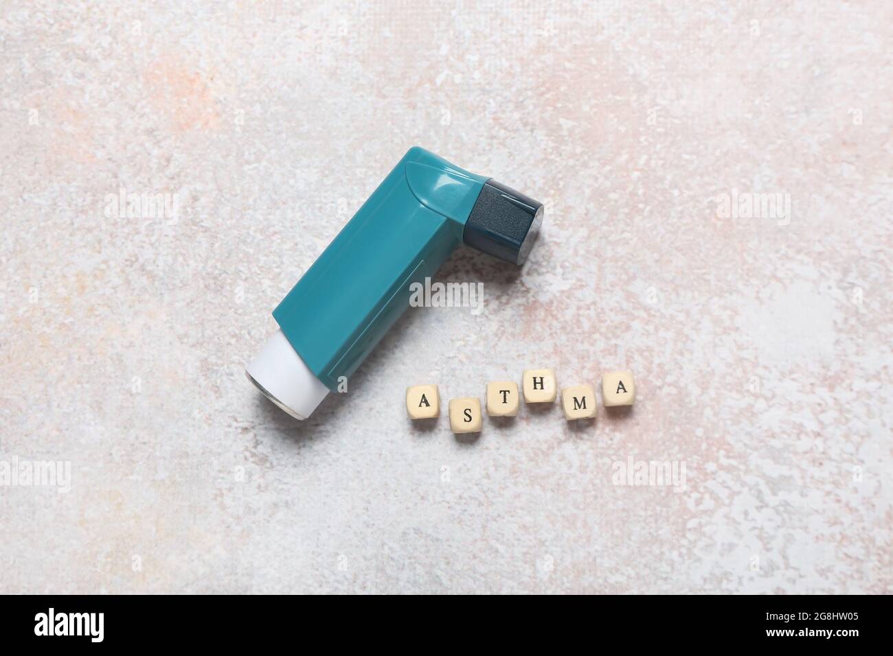 Modern inhaler and word ASTHMA on grunge background Stock Photo - Alamy