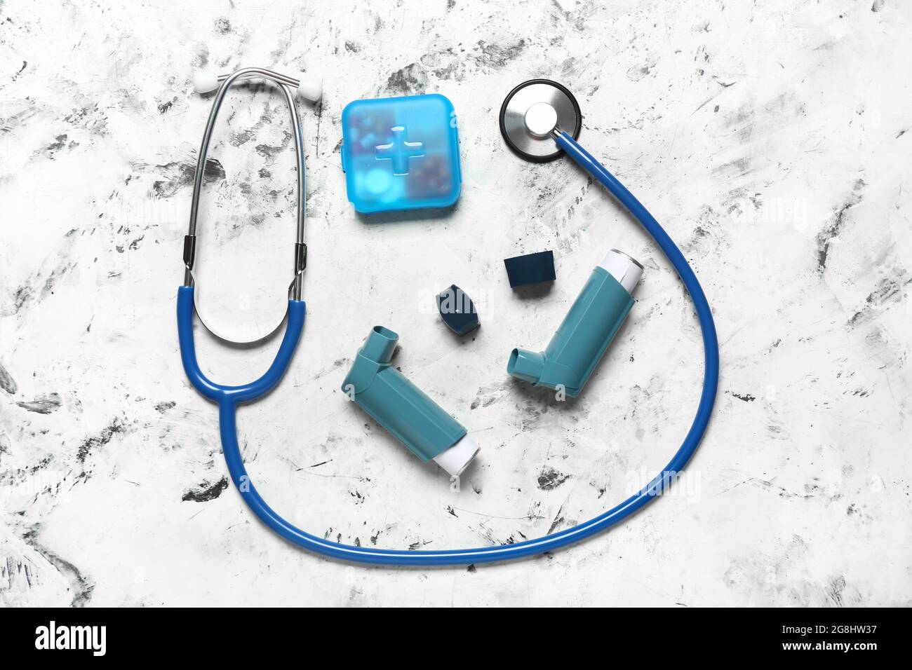 Modern inhalers, pills and stethoscope on grunge background Stock Photo ...
