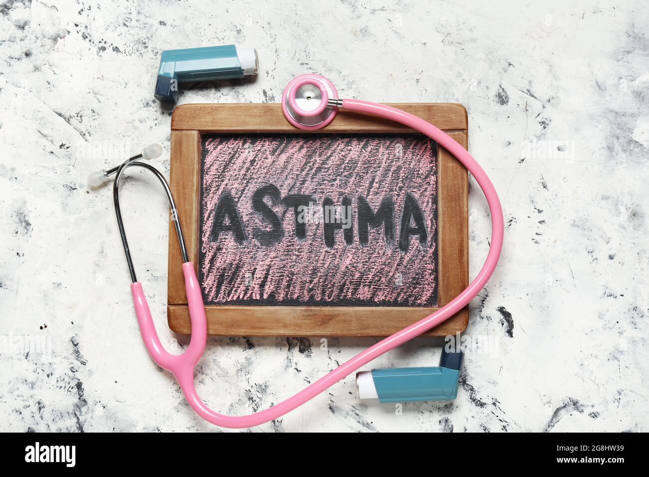Chalkboard with word ASTHMA, inhalers and stethoscope on grunge ...