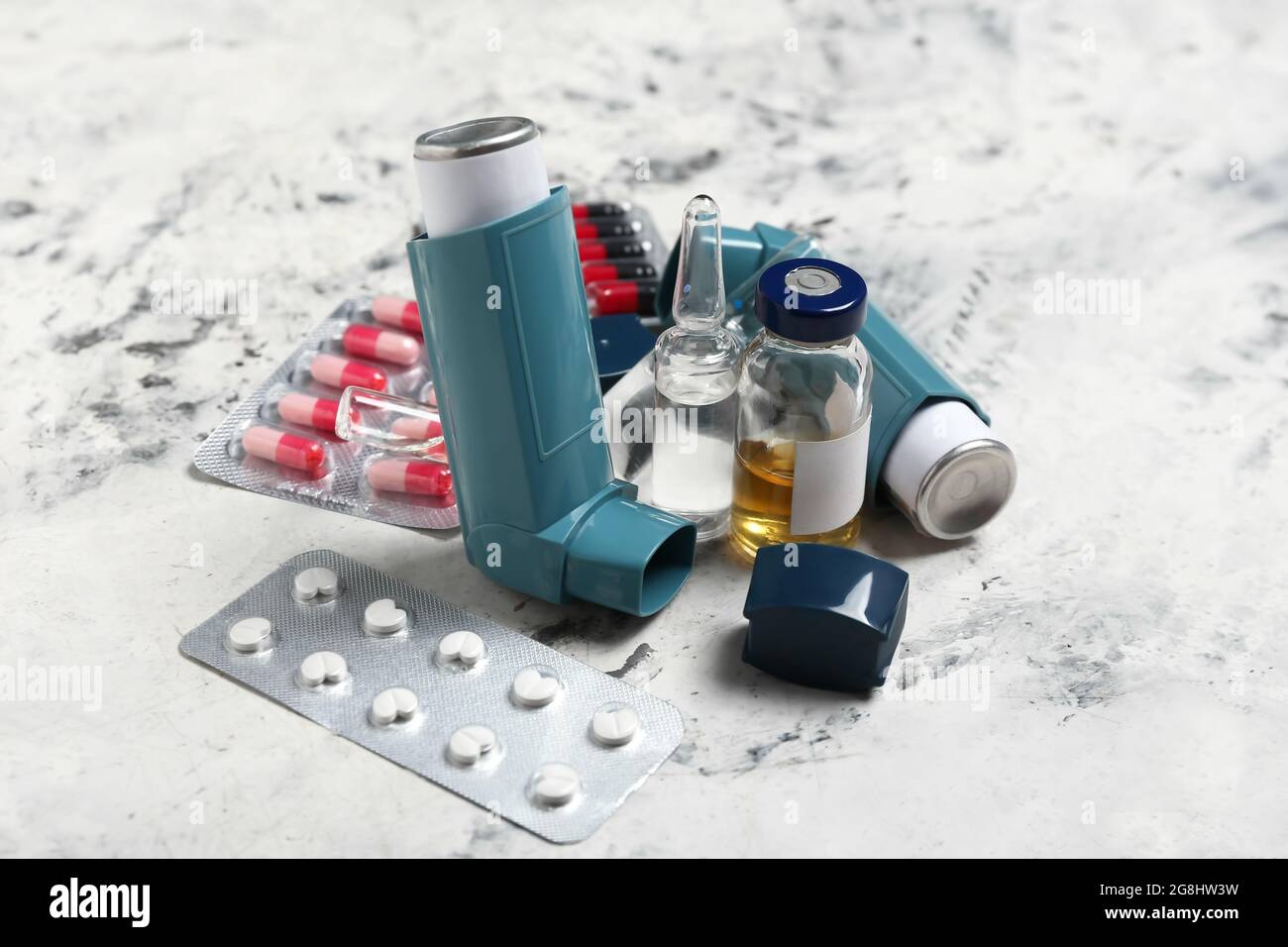 Inhalers and medicines on grunge background Stock Photo - Alamy