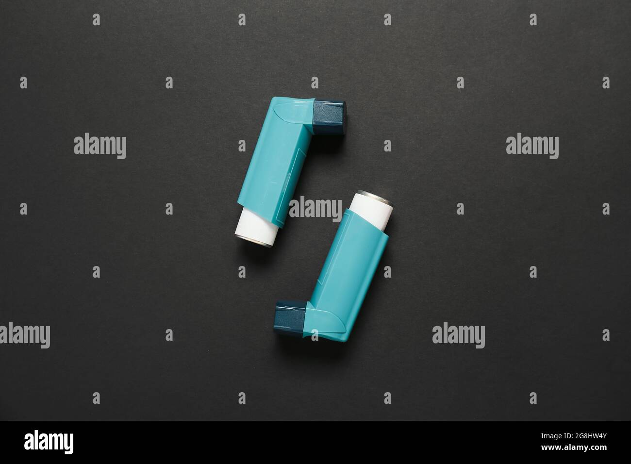 Modern inhalers on dark background Stock Photo - Alamy