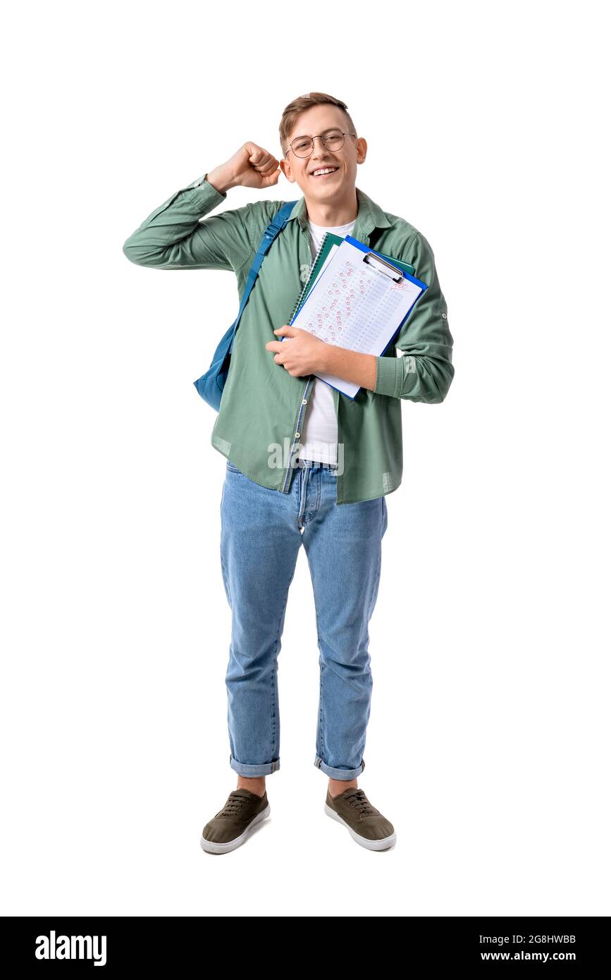 Happy student with answer sheet for school test on white background ...