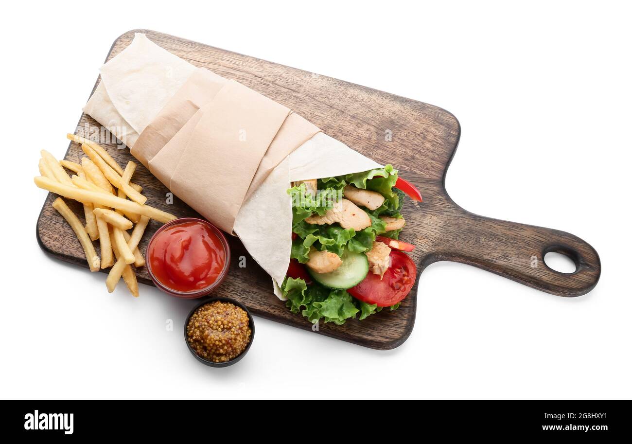 Board with tasty doner kebab, sauces and french fries on white ...