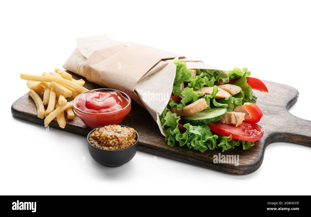 Board with tasty doner kebab, sauces and french fries on white ...