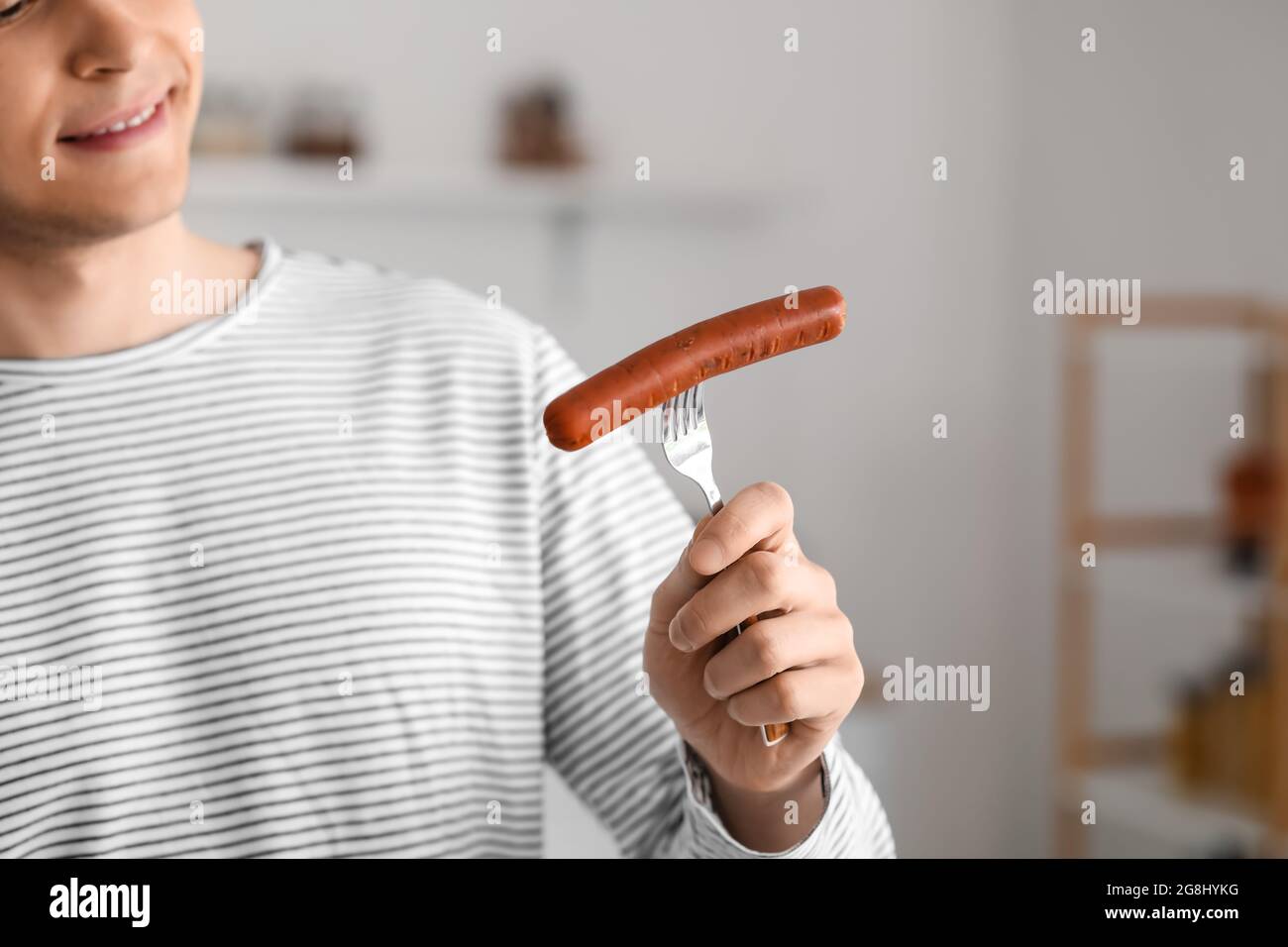 Man eating breakfast sausages in hi-res stock photography and images ...