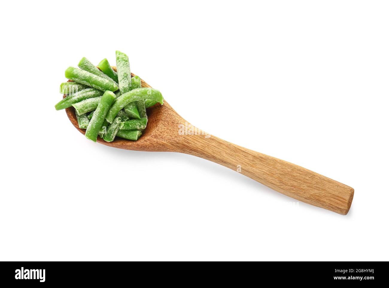 Spoon with frozen green beans on white background Stock Photo - Alamy