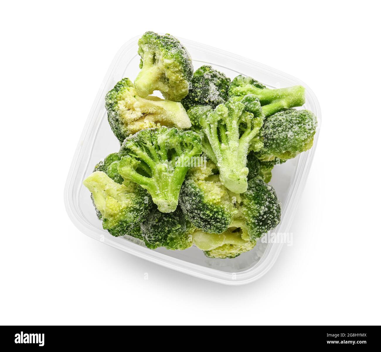 Container with frozen broccoli on white background Stock Photo - Alamy