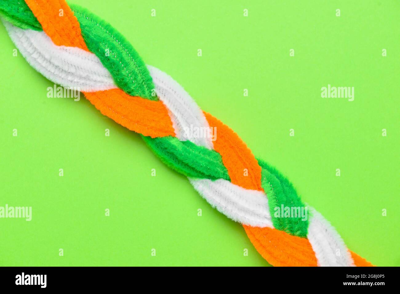 Braid in colors of Indian flag on green background Stock Photo - Alamy