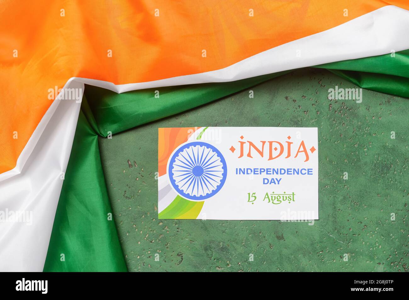 Indian flag and greeting card for Independence Day on color background ...