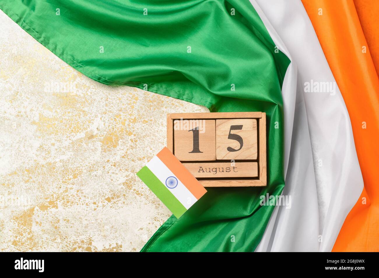 Indian flags and calendar with date 15 August on light background ...