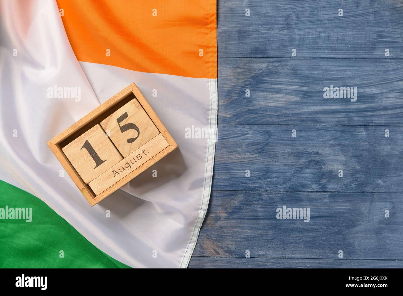 Indian flag and calendar with date 15 August on wooden background ...