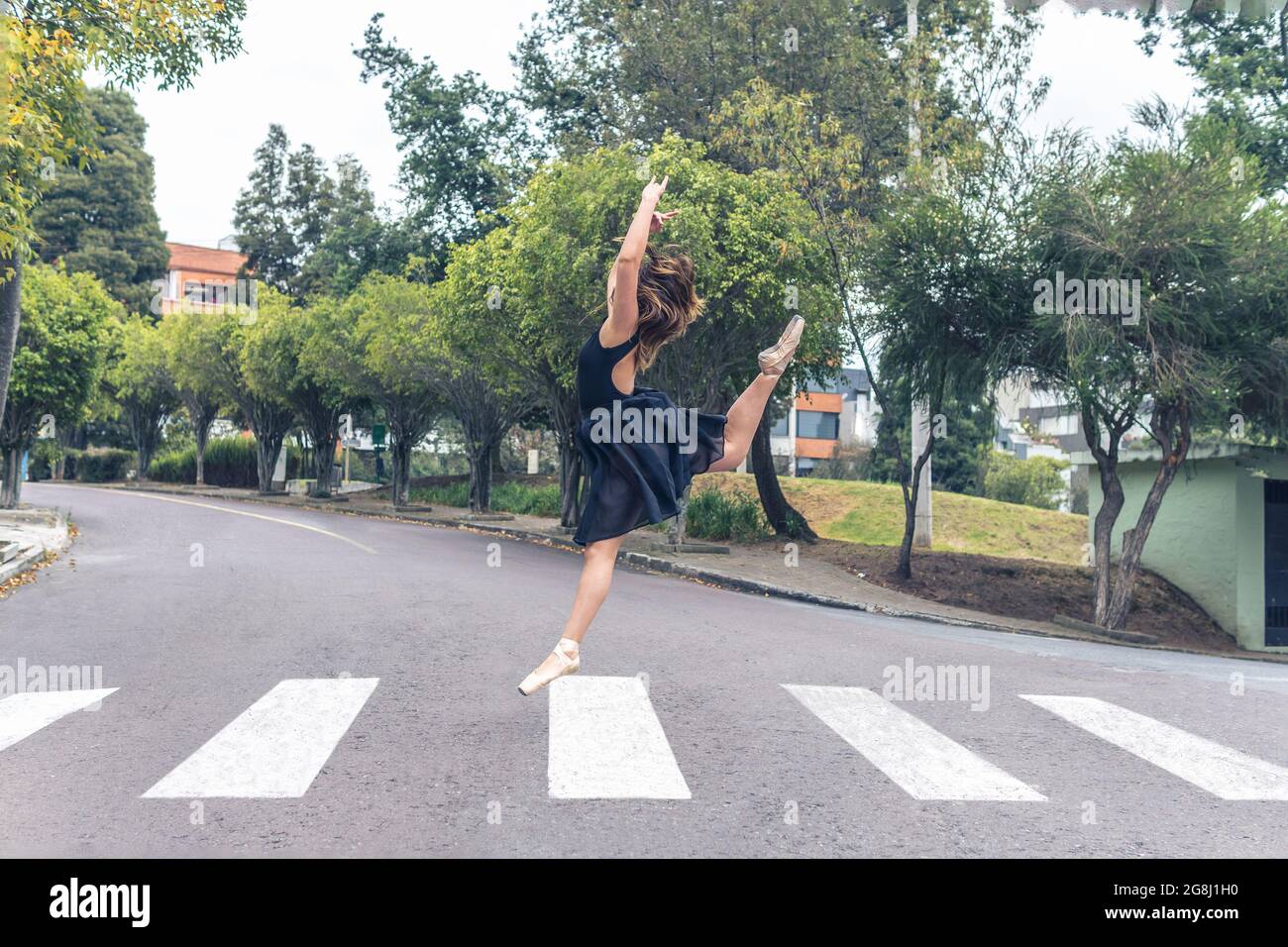 Female ballet dancer dancing on a crosswalk Stock Photo - Alamy