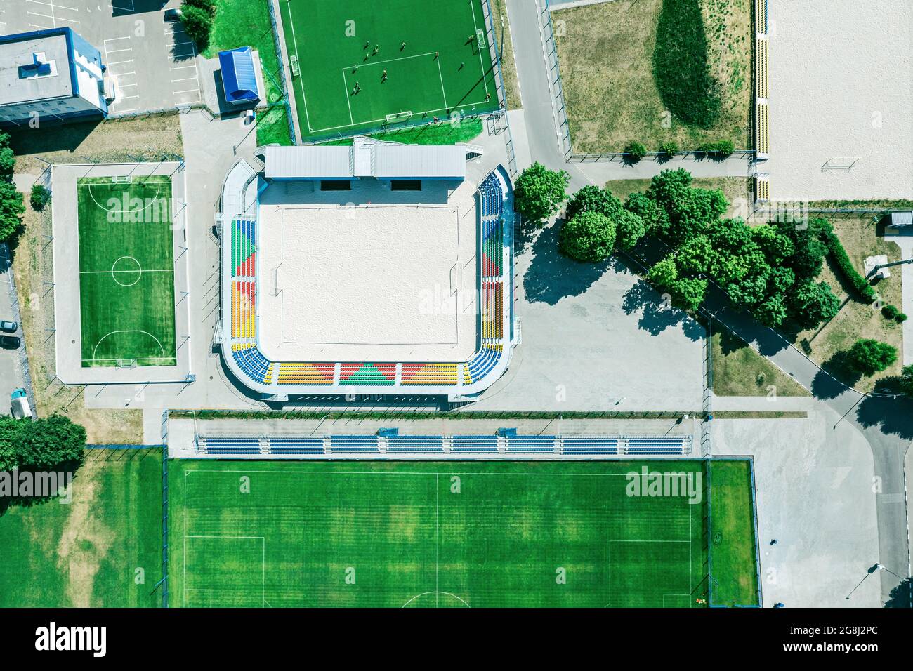 aerial top view of football fields in sports facility at sunny summer ...