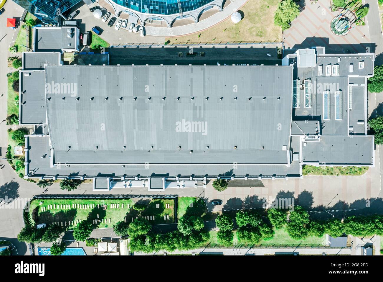 shingle roof of modern building with ventilation systems and skylights ...