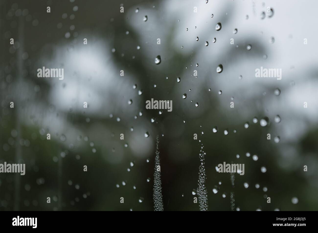 rain drops during raining in rainy day outside window glass with ...