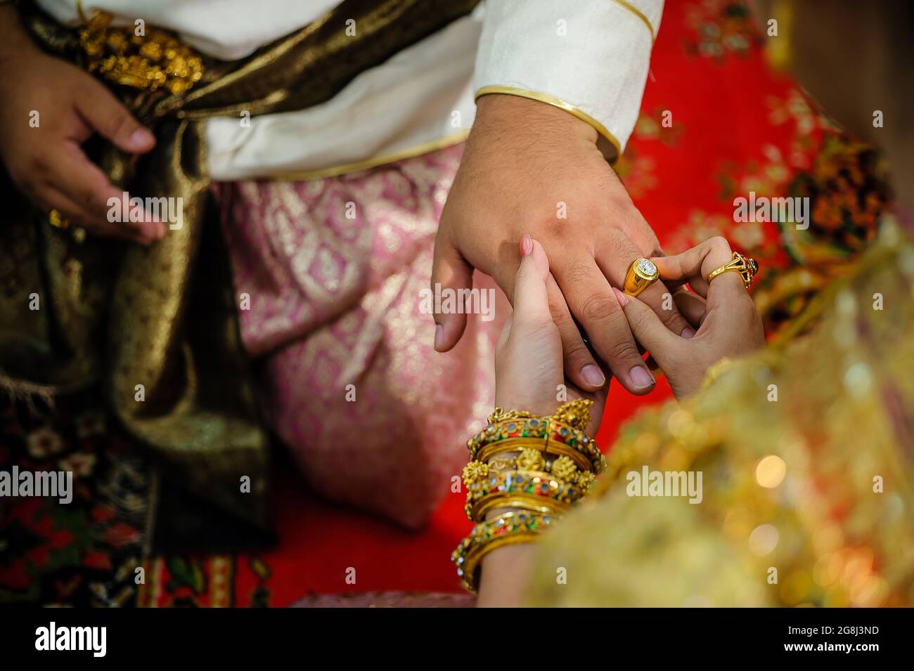 wedding rings together in hands Stock Photo - Alamy