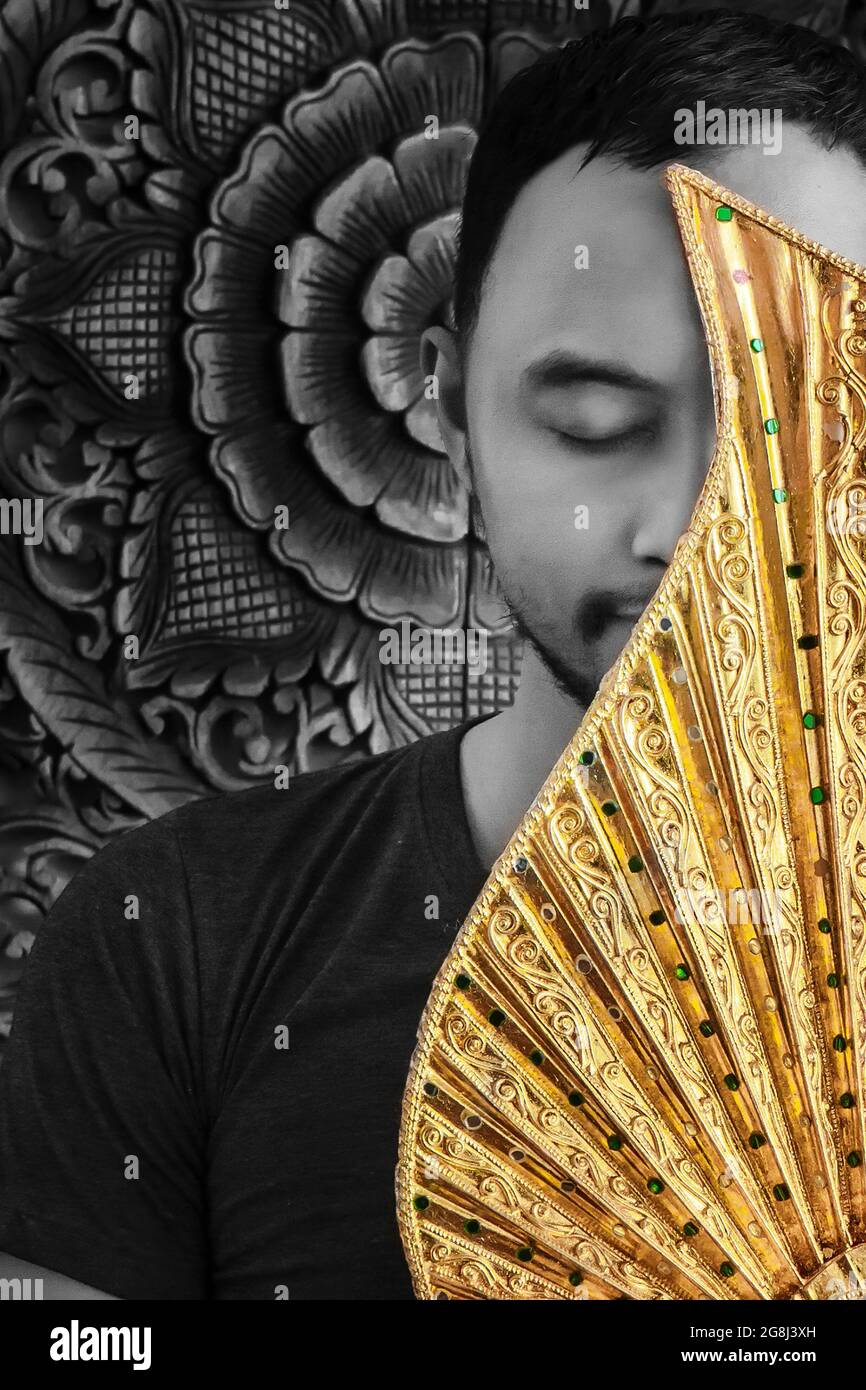 Men's photographs convey an artistic perspective.guy holding a golden ...