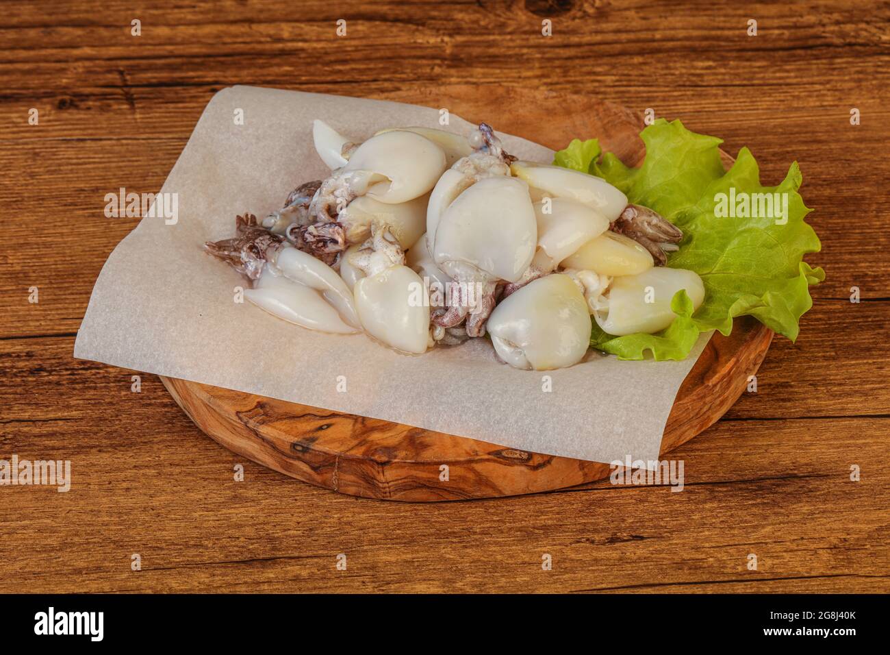Raw seafood - cuttlefish for cooking over board Stock Photo - Alamy