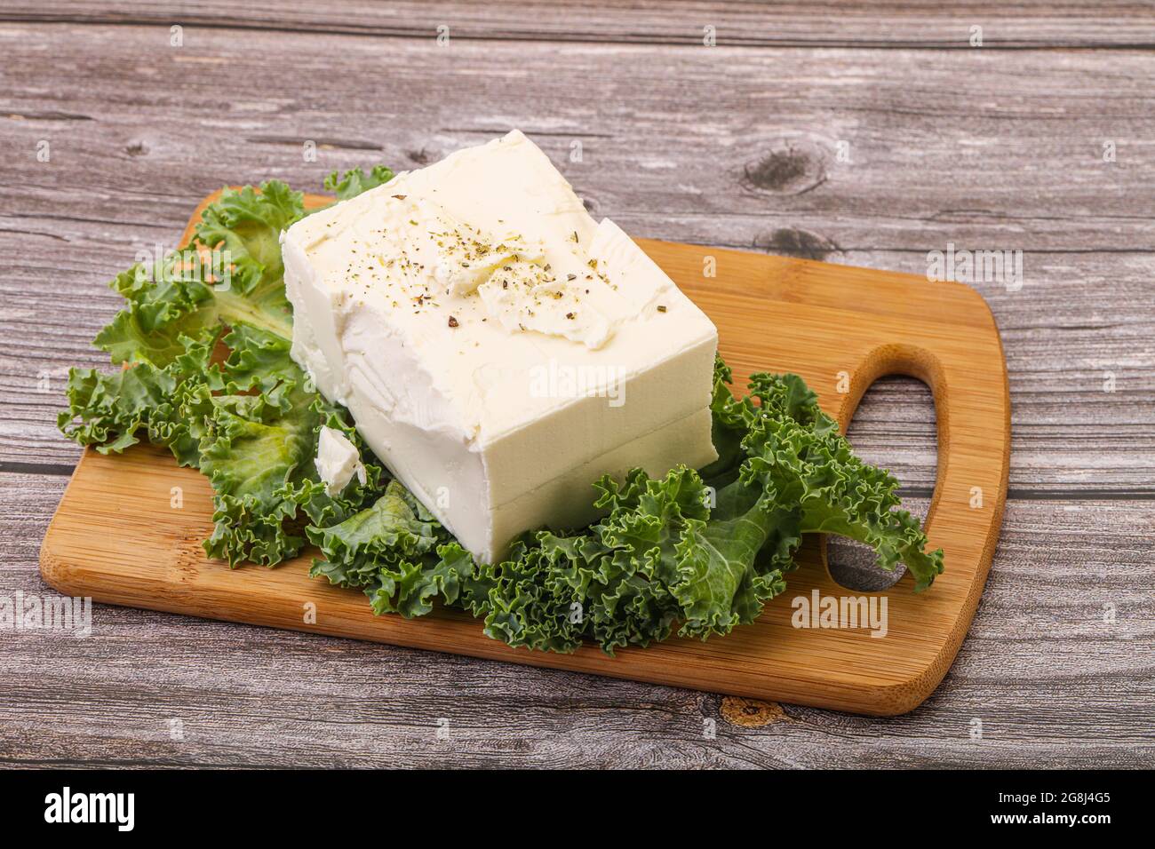 Traditional tasty Greek Feta soft cheese brick Stock Photo - Alamy