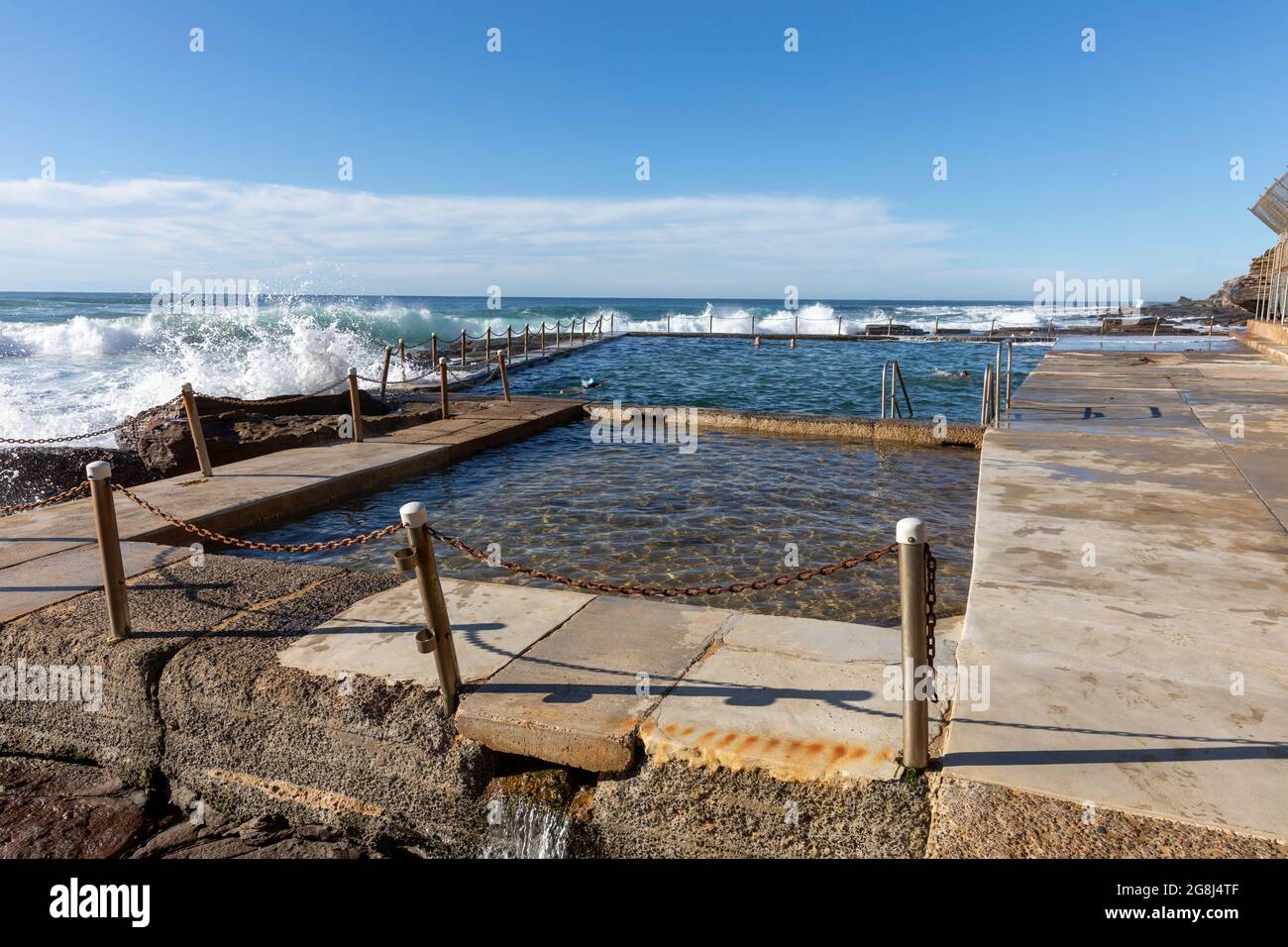Ocean rock swimming pool at Avalon Beach in Sydney with people swimming ...