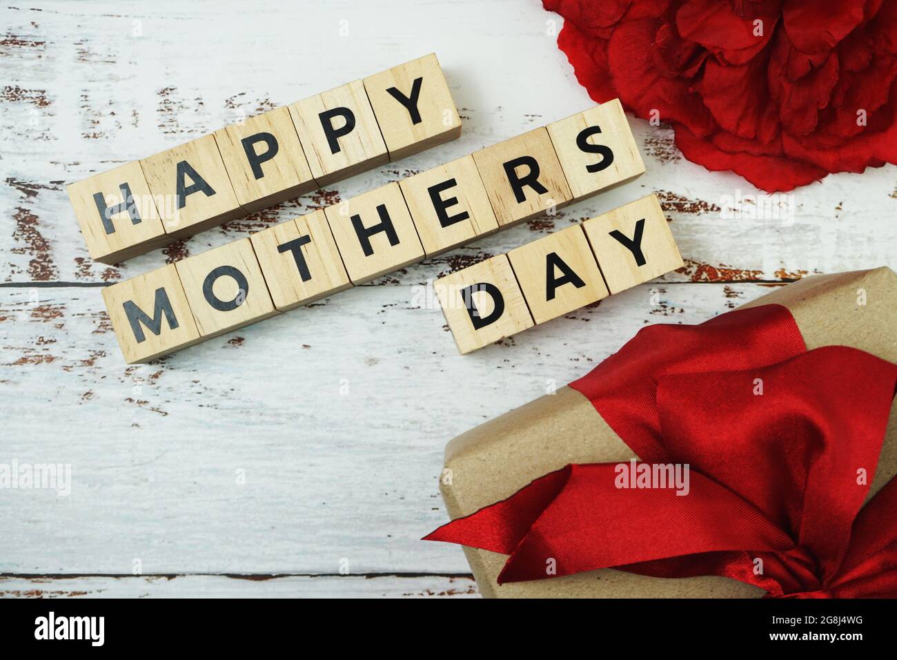 Happy Mother's day alphabet letters with gift box top view on wooden ...