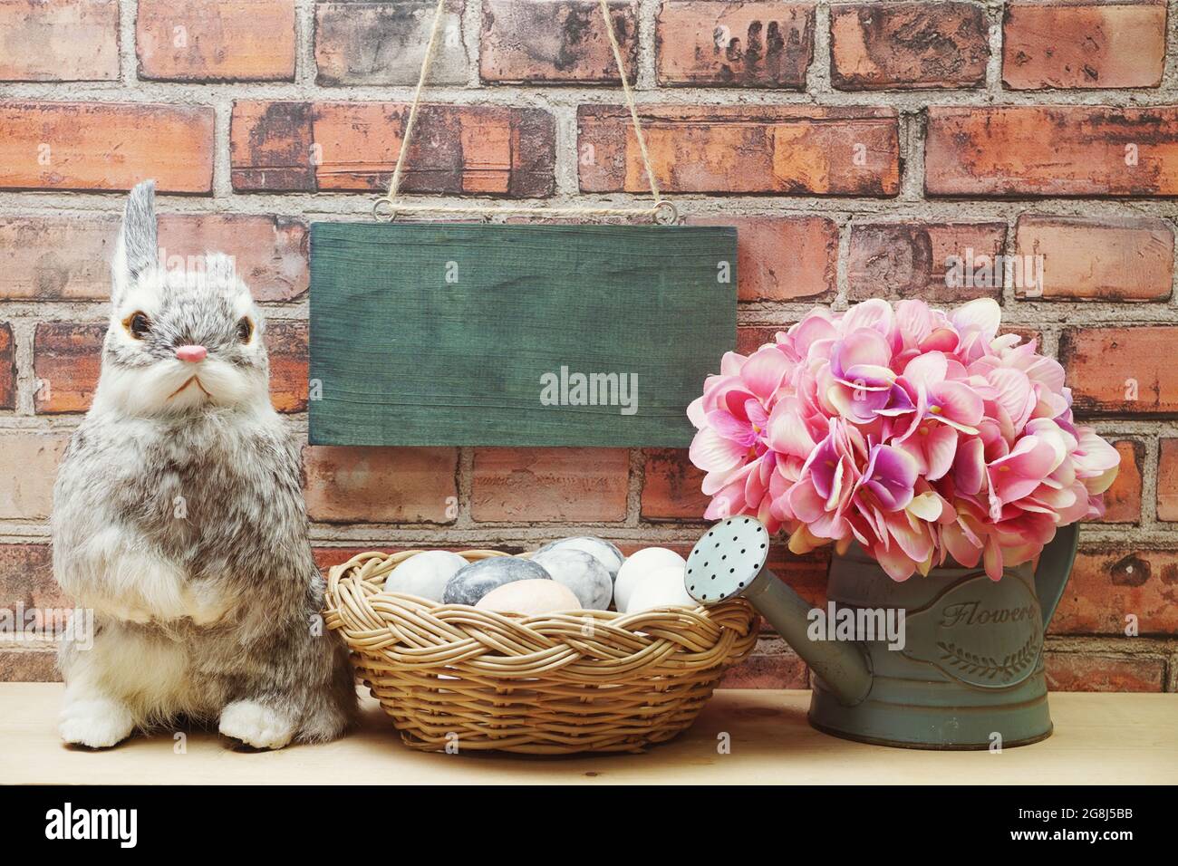 Empty wooden hanging on old brick wall with Easter Eggs on wooden shelve Stock Photo - Alamy