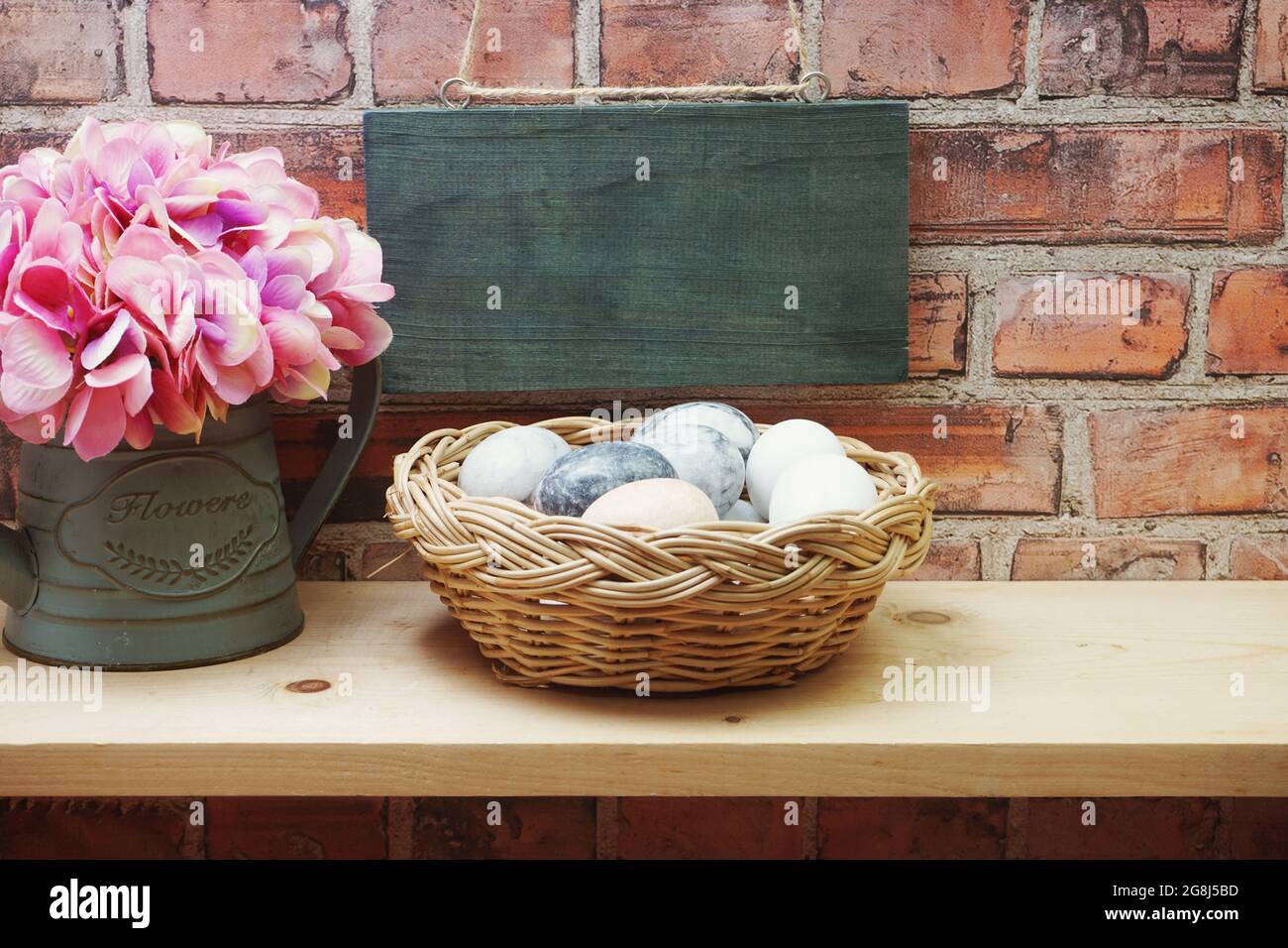 Empty wooden hanging on old brick wall with Easter Eggs on wooden shelve Stock Photo - Alamy