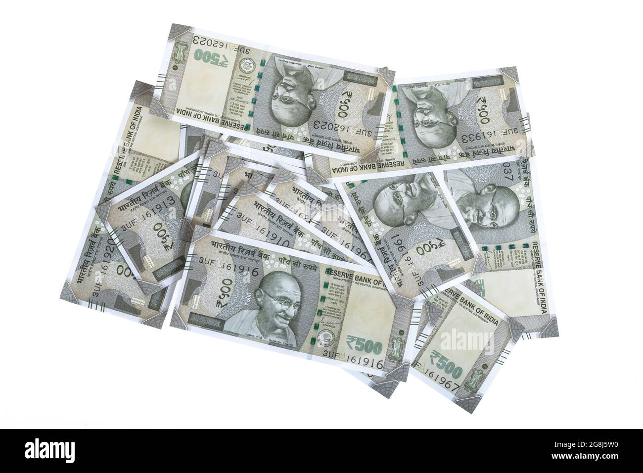 Top view of a pile of Indian 500 rupee bills on a white isolated ...