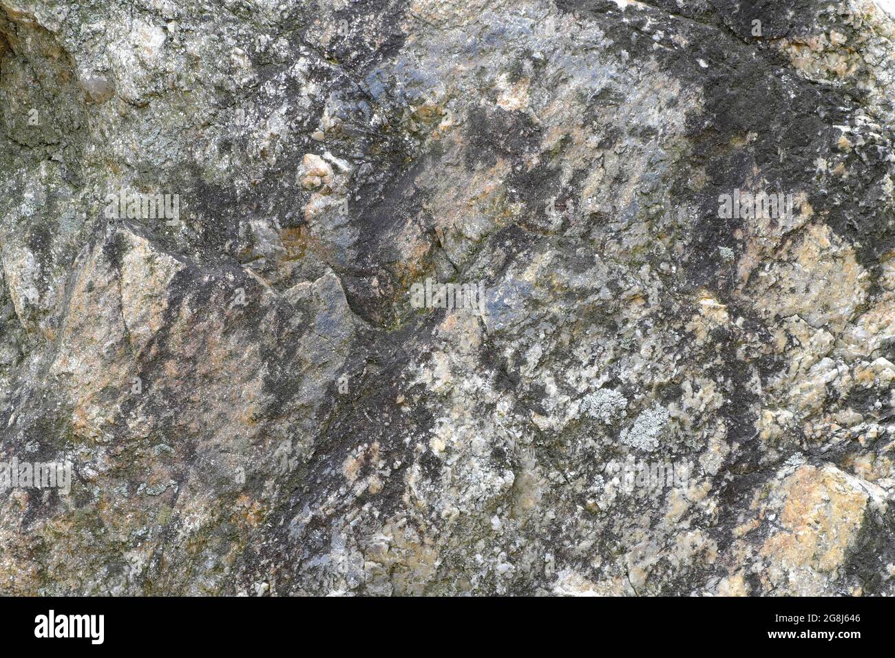 Variegated, multicolored texture of natural rock stone. Background ...