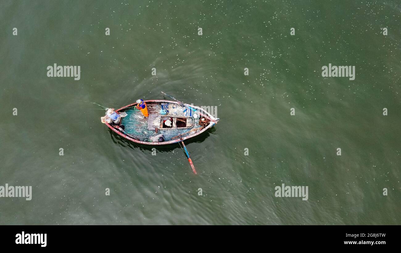 Top view, aerial view wooden fishing boat on the beach from a drone ...