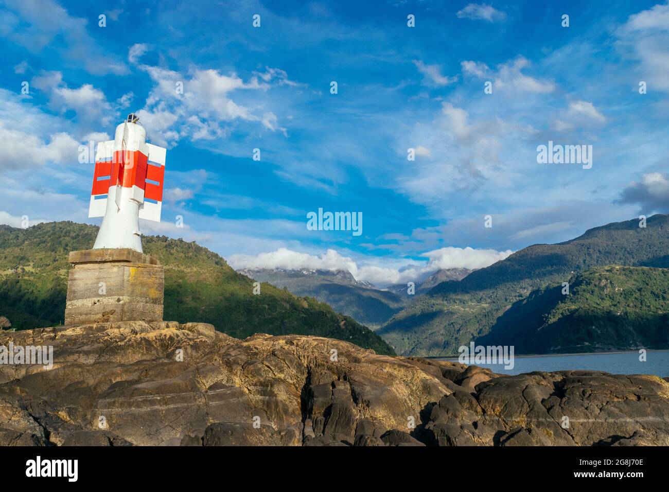 The harbor ramp leads to a lighthouse on a small island in Cochamo ...