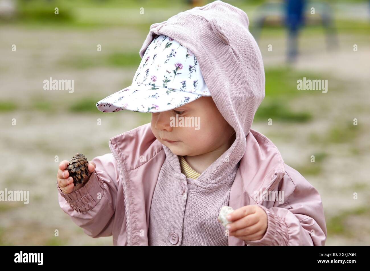 Little girl play in the park and have a good time. The concept of a ...