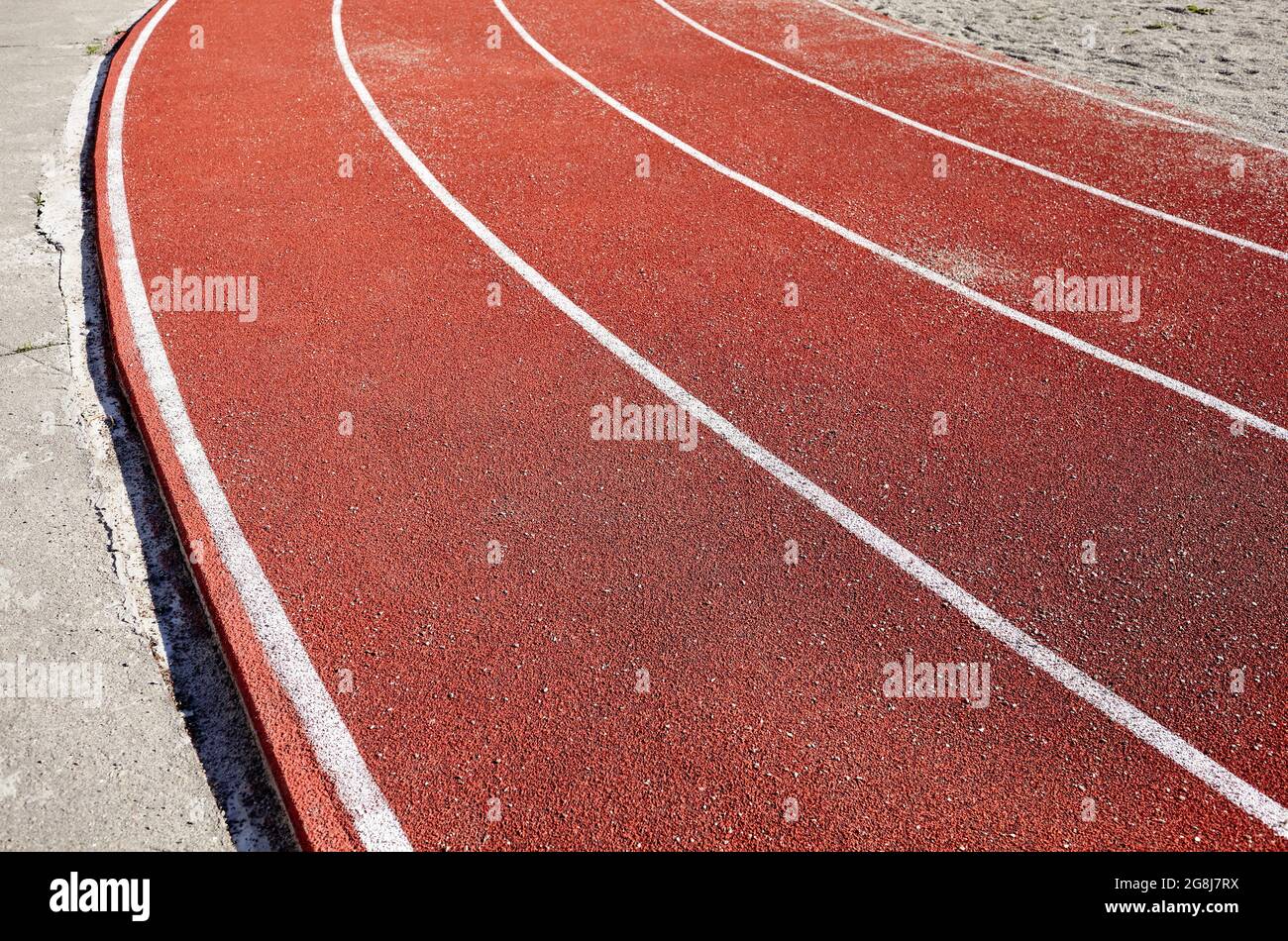 Red treadmill on sport field. Running track on the stadium Stock Photo ...