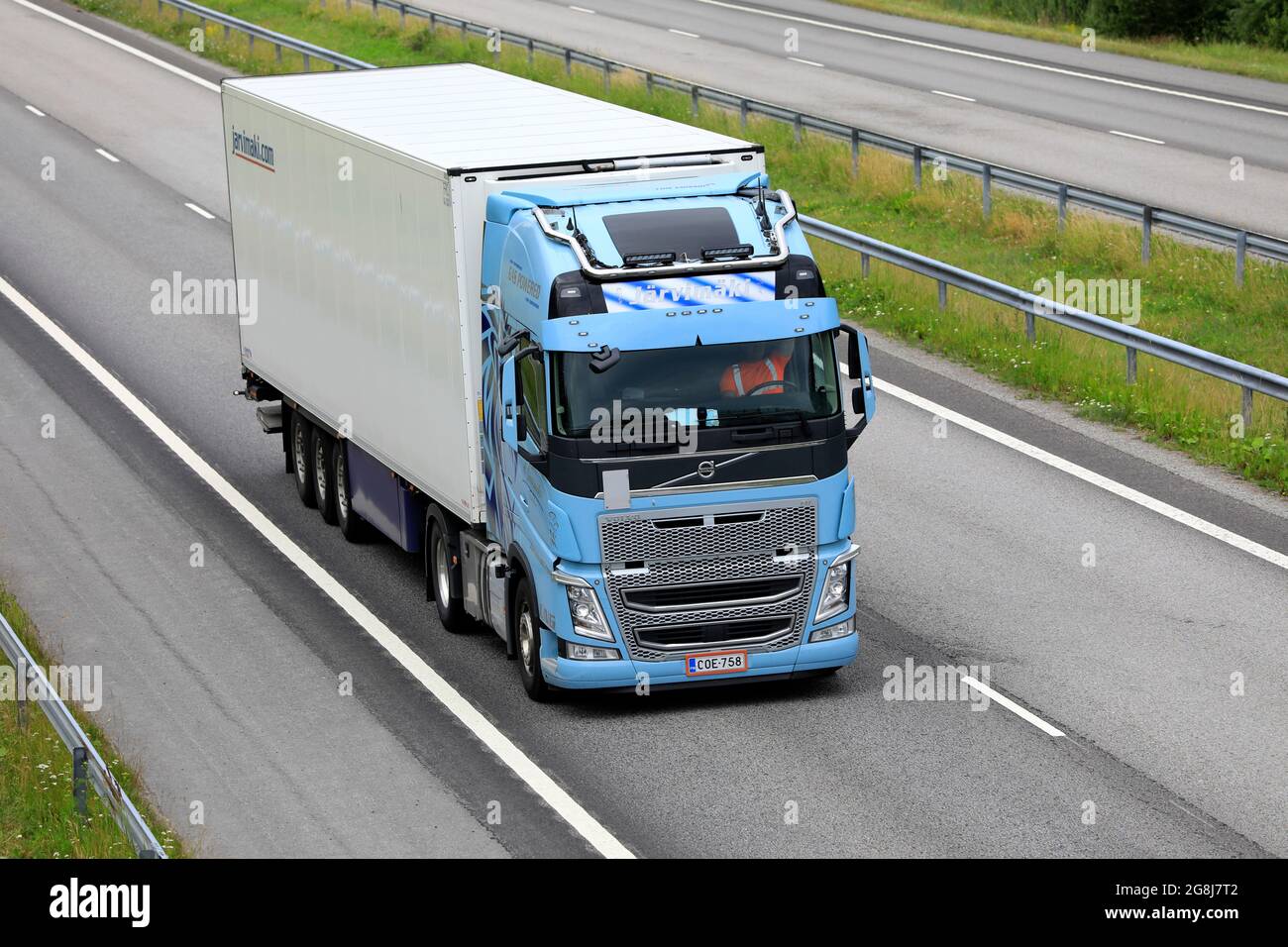Blue LNG-powered Volvo FH truck Jarvimaki in front of temperature ...