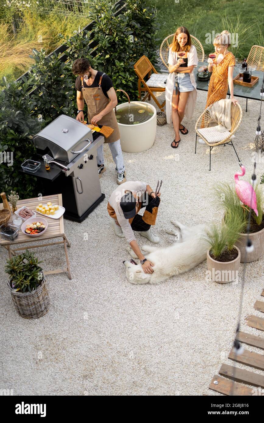 People hanging out at backyard Stock Photo - Alamy